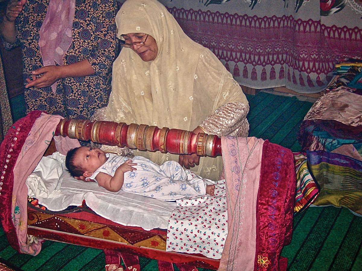 Woman Imam with Cradle | World Quilts: The Central Asian Story